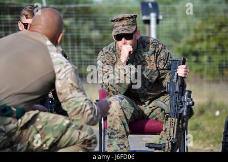 Royal Marine Commando Sgt. Chris Abrams supervises the conduct of the ...
