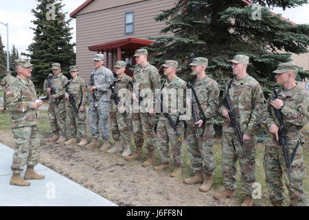 Command Sgt. Maj. Michael Ferrusi (center), U.S. Army Alaska command ...
