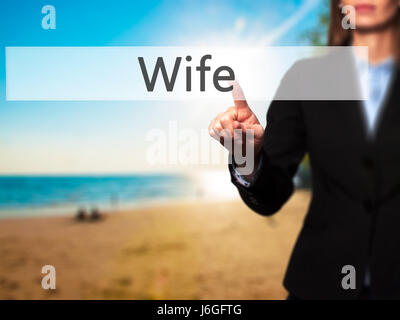 Wife - Businesswoman pressing high tech modern button on a virtual ...