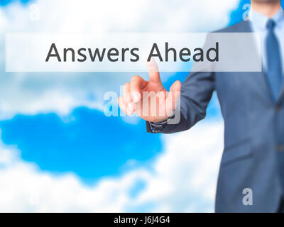 Answers Ahead - Businessman hand touch button on virtual screen ...