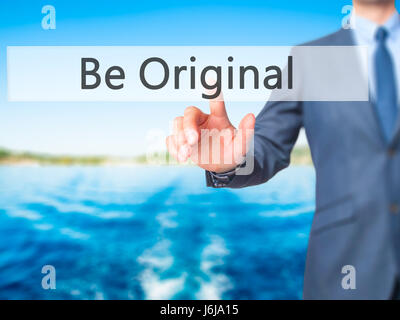 Be Original - Businessman hand pressing button on touch screen ...