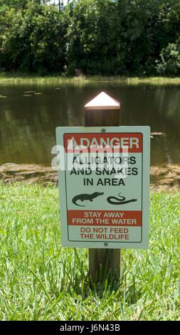 Alligator and snake danger warning sign near canal - Davie, Florida ...
