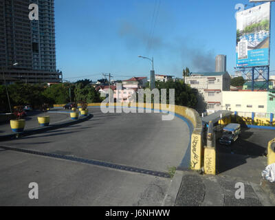 The *Makati-Mandaluyong City Bridge* spans across the Pasig River ...