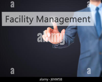 Facility Management - Businessman hand pressing button on touch screen ...