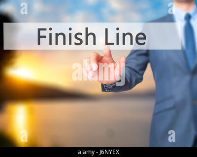 Finish Line - Businessman hand pressing button on touch screen ...