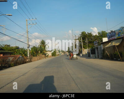 This photograph shows Candaba Town Proper with both old and new bridges ...