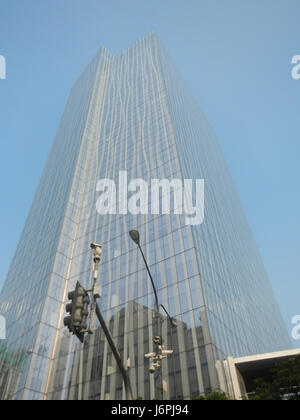 This image depicts the Zuellig Building, a modern skyscraper located in ...