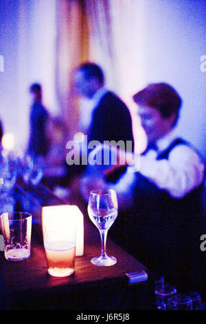 VIP wedding party evening marriage drinks reception with waiter and bar ...
