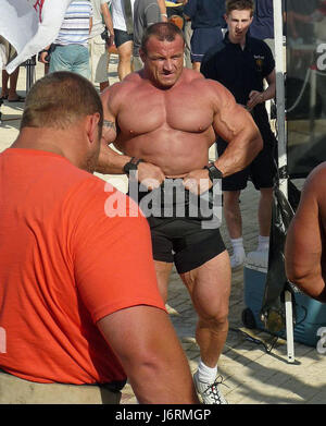 A photograph of Mariusz Pudzianowski, a renowned Polish strongman and ...