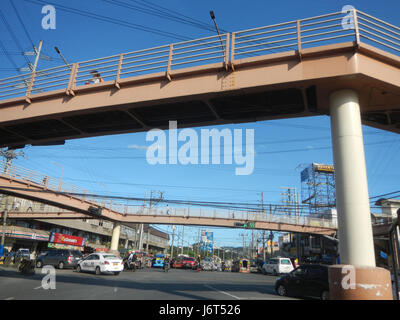 This image features the pedestrian footbridge near Tayuman and Juan ...