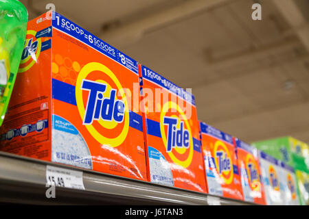 A row of Tide brand powder laundry detergent boxes on grocery store ...