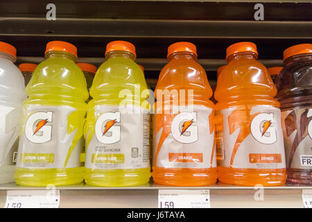 bottles of different flavored Gatorade for sale on the shelves of a ...