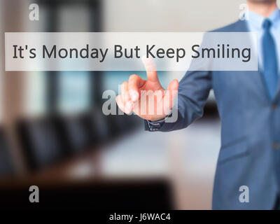 It's Monday But Keep Smiling - Businessman hand holding sign. Business ...