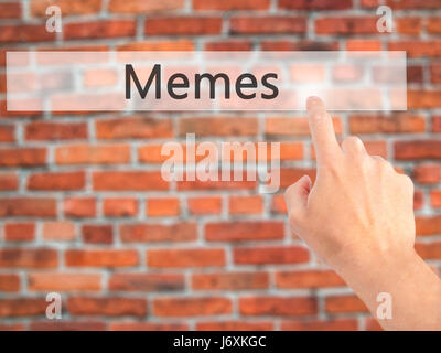 Memes - Hand pressing a button on blurred background concept . Business ...