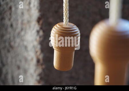 Wooden knobs or handles on a curtain pull cord Stock Photo - Alamy