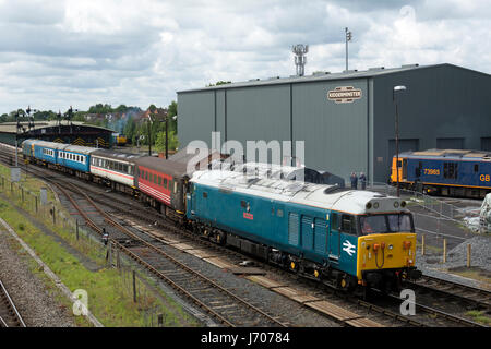 Class 50 diesel locomotive pulling a passenger train at Liskeard ...