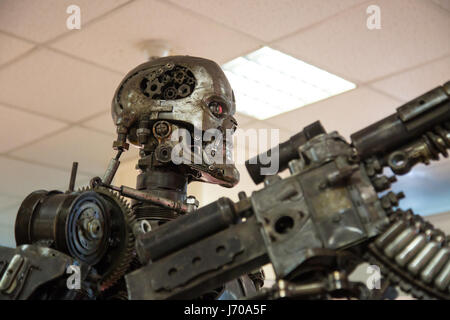 Robot (metal) assassin with automatic weapon Stock Photo - Alamy
