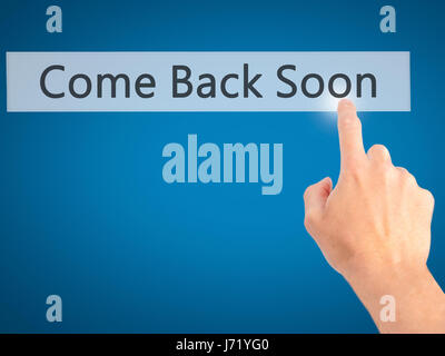 Come Back Soon - Hand pressing a button on blurred background concept ...
