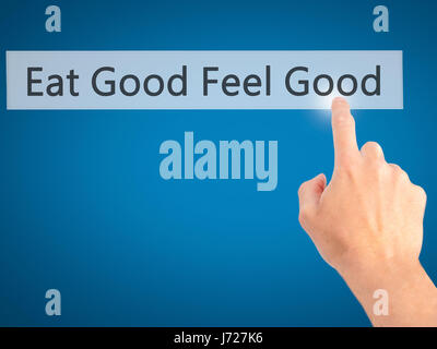 Feel Good - Hand pressing a button on blurred background concept ...