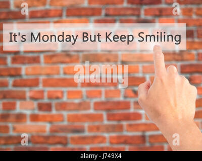 It's Monday But Keep Smiling - Hand pressing a button on blurred ...