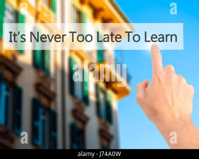 Its Never Too Late To Learn Sign on white paper. Man Hand Holding Paper ...