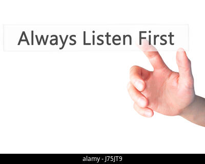 Always Listen First - Hand pressing a button on blurred background ...