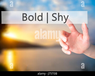 Bold Shy - Hand pressing a button on blurred background concept ...