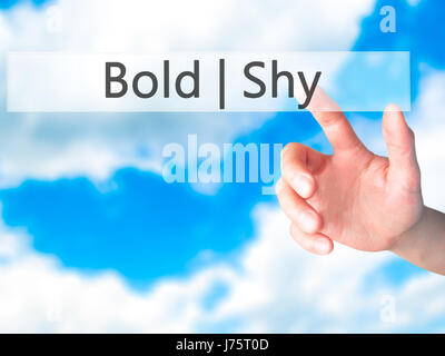 Bold Shy - Hand pressing a button on blurred background concept ...