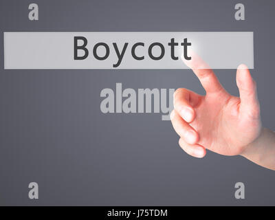Boycott - Hand pressing a button on blurred background concept ...