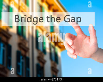 Bridge the Gap - Hand pressing a button on blurred background concept ...