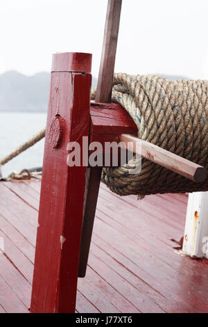 Closeup of fishing boat parking with rope for anchor Stock Photo - Alamy