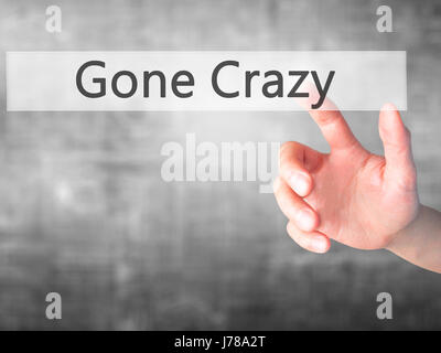 Gone Crazy - Hand pressing a button on blurred background concept ...