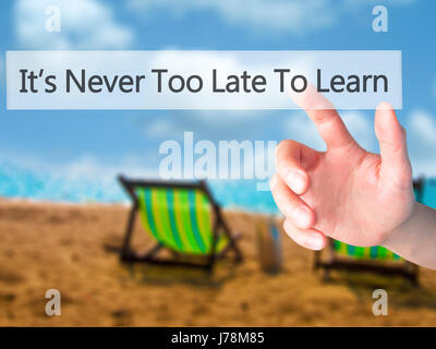 Its Never Too Late To Learn Sign on white paper. Man Hand Holding Paper ...