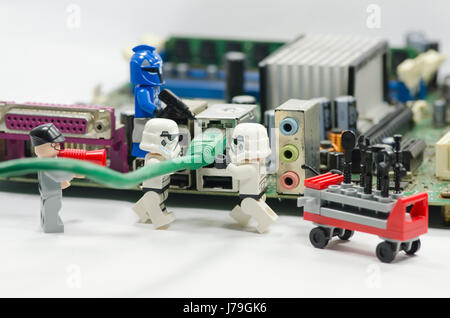 lego starwars minifigures working to plug in internet cable to the port ...