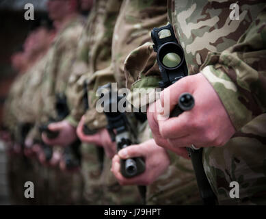 A soldier holding a SA80 rifle at a British "Army Air Corps ...