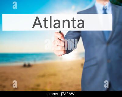 Atlanta - Business man showing sign. Business, technology, internet ...