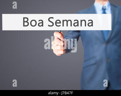 Boa semana (Good WeekIn portuguese) - Businessman hand touch button on ...