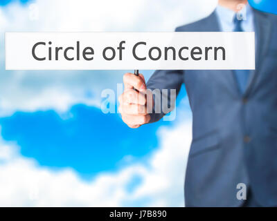 Circle of Concern - Businessman hand holding sign. Business, technology ...