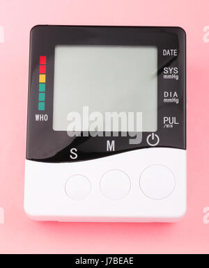 Black tonometer and heart on blue background Stock Photo - Alamy