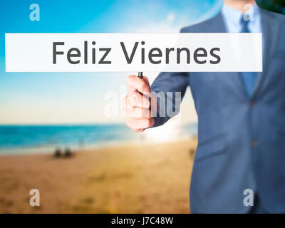 Feliz Viernes (Happy Friday In Spanish) Sign on white paper. Man Hand ...