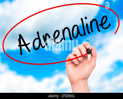 Man Hand writing Adrenaline with black marker on visual screen ...