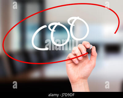Man Hand writing COO (Chief Operating Officer) with black marker on ...