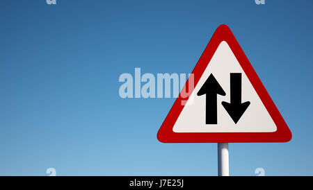 Red triangle sign two way traffic Stock Photo - Alamy