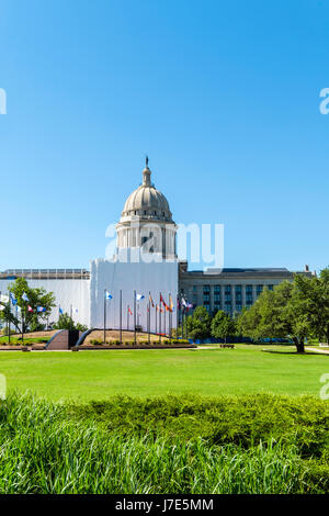 Flags of the United States of America and Oklahoma State from flagpoles ...