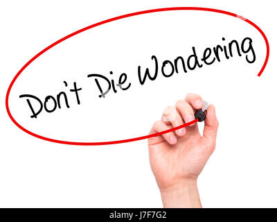 Man Hand writing Don't Die Wondering with black marker on visual screen ...