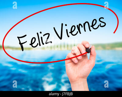 Man Hand writing Feliz Viernes (Happy Friday In Spanish) with black ...