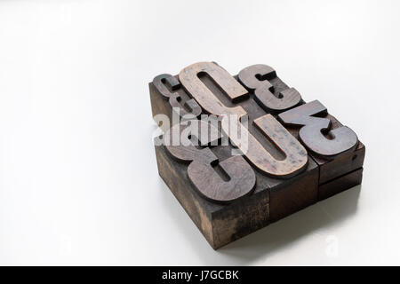 Old number three letterpress printing block isolated on a white ...
