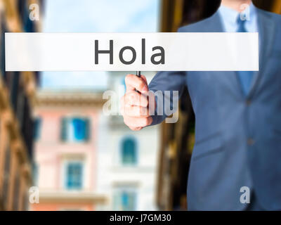 Hola - Businessman hand holding sign. Business, technology, internet ...