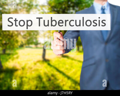 Stop Tuberculosis - Businessman hand holding sign. Business, technology ...