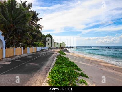 The road along the ocean's beach, Mahe, Seychelles Stock Photo - Alamy